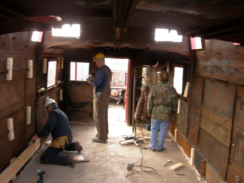 Crew working on interior of CMRR 675 N5B Caboose: The GreatRails North American Railroad Photo ...